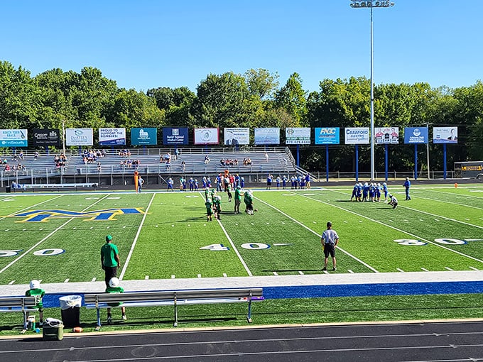 Bomber Stadium on game day: where Friday night lights illuminate community pride and everyone knows the quarterback's aunt.