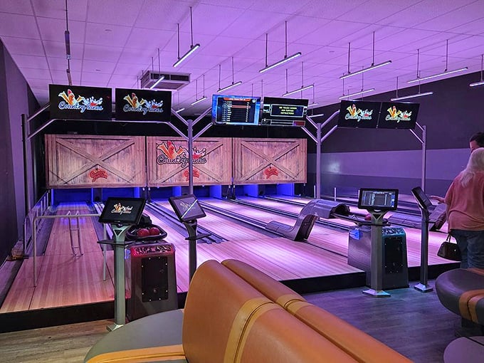 The bowling alley glows with neon promise – because nothing says "I just came for milk" like rolling a perfect strike in the middle of your shopping trip.
