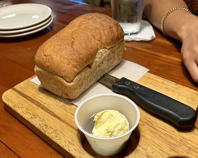 Fresh-baked bread with a side of butter—the opening act that sets the stage for the meaty main event to follow.