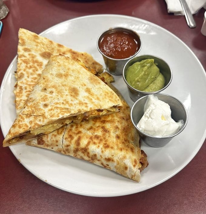 Breakfast quesadillas that blur the line between cultures and mealtimes, served with three dipping sauces for your diplomatic relations.