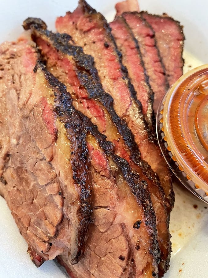 Brisket with a smoke ring so perfect it could win beauty pageants in Texas – juicy, tender barbecue royalty.