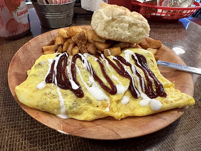 This isn't just an omelet—it's a flavor explosion draped in BBQ sauce and cream, where breakfast and lunch have a delicious identity crisis.