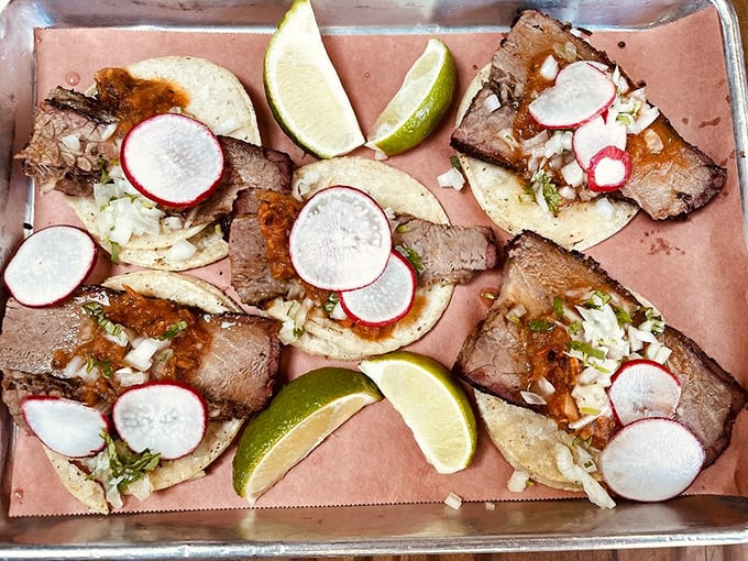 Brisket tacos that bridge cultures: tender smoked meat meets fresh radish, lime, and cilantro in a handheld flavor explosion.