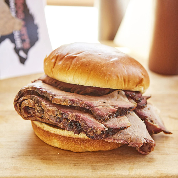 Brisket that doesn't need words—just appreciative silence. Those perfectly sliced ribbons of beef tell a story of patience, smoke, and barbecue mastery.