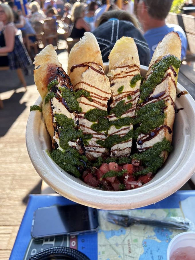 Bruschetta that's dressed to impress with vibrant pesto, balsamic drizzle, and enough fresh flavor to make an Italian grandmother nod in approval.