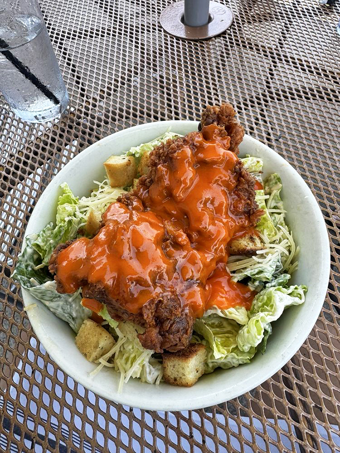 Buffalo Caesar salad that proves healthy eating doesn't mean flavor sacrifice. That crispy chicken is doing some serious heavy lifting.