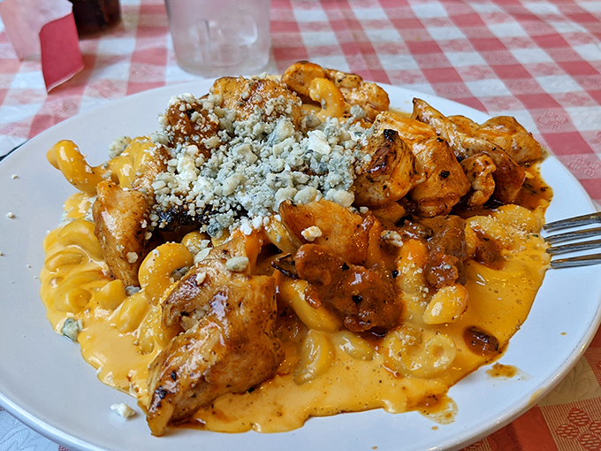 Buffalo chicken mac and cheese—where comfort food gets a spicy makeover. Blue cheese crumbles add that perfect sharp counterpoint to the creaminess.