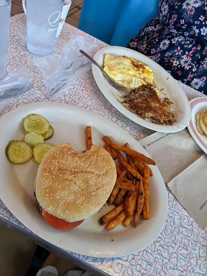 The classic diner burger and fries combo—proving that sometimes the simplest pleasures require two hands and zero pretension.