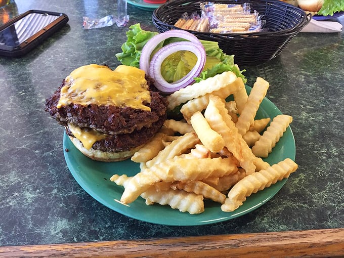 This isn't just a burger – it's a hand-held masterpiece of beef, cheese, and possibility, escorted by a golden honor guard of fries.