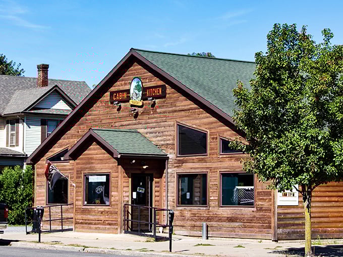 The Cabin Kitchen's rustic log exterior promises exactly what you're hoping for—comfort food served in surroundings that feel like a warm hug.