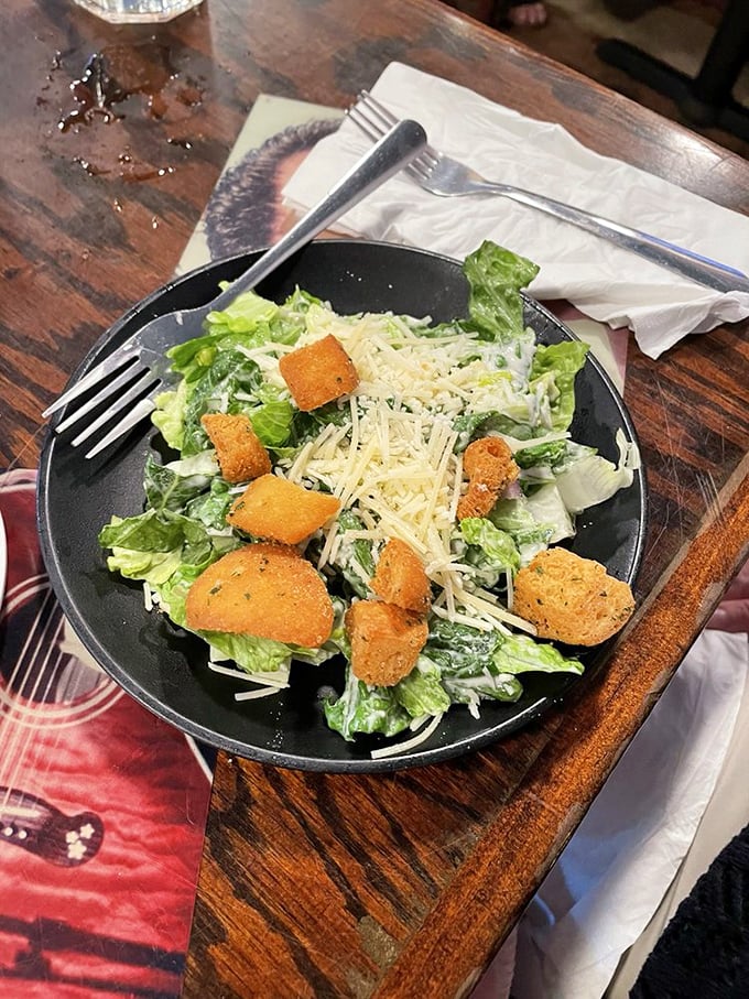 A Caesar salad that doesn't apologize for being simple—crisp romaine, golden croutons, and enough parmesan to make a Roman proud.