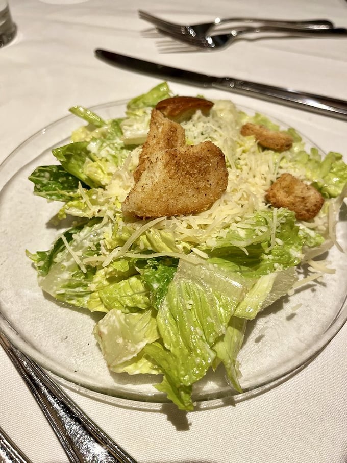 A proper Caesar salad—crisp, cheesy, with croutons that crunch like autumn leaves. Simple perfection that never goes out of style.