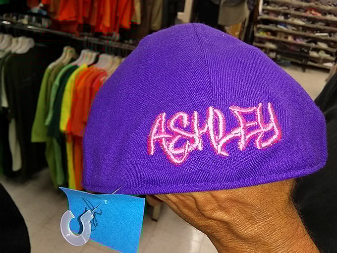 That purple "Ashley" cap is either the perfect ironic accessory or someone's regrettable impulse purchase. Either way, it's your chance now.