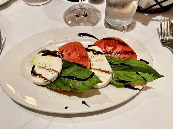 The classic Caprese salad—where tomatoes, mozzarella, and basil perform a simple yet perfect harmony that would make an Italian opera singer weep.