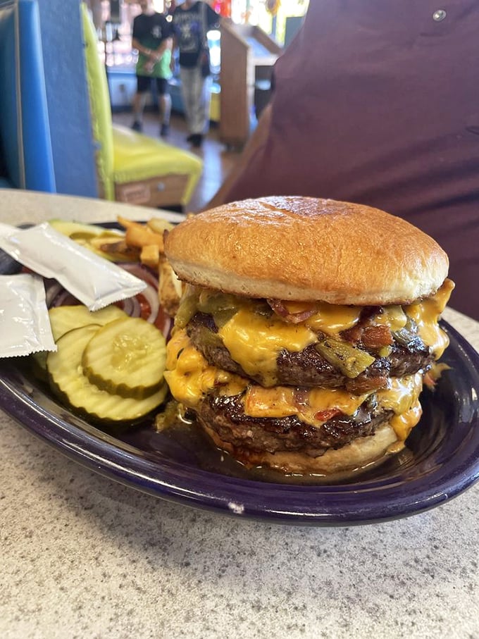 Charlie's burger stacks two patties high with cheese, bacon, and jalapeños because subtlety is highly overrated here.