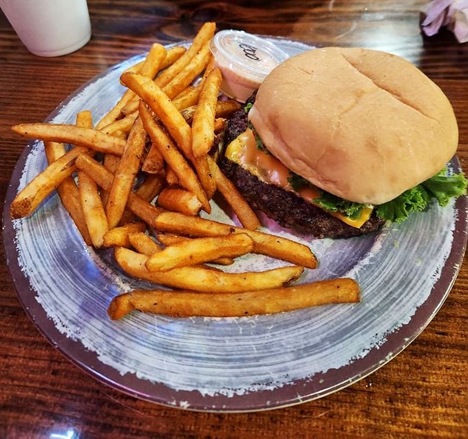 That cheeseburger means business, partnered with fries that look like they graduated top of their class.