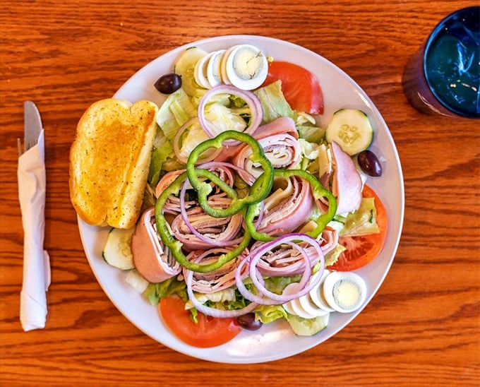 A chef salad arranged with the precision of a Swiss watchmaker—where every bite delivers the perfect balance of fresh ingredients.