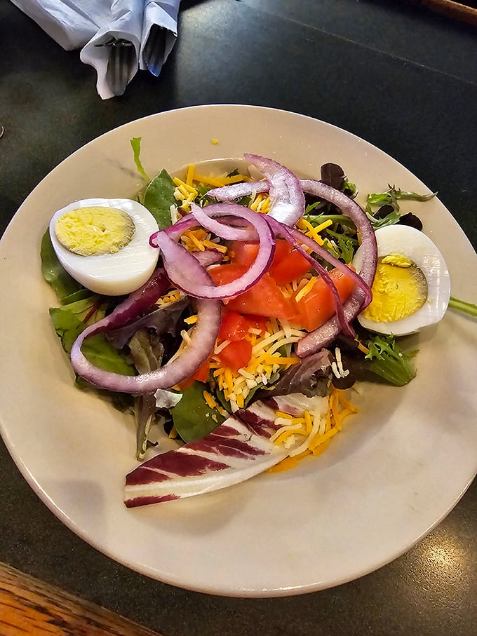 A salad that actually looks like it's trying—fresh ingredients arranged with care rather than tossed from across the kitchen with indifference.