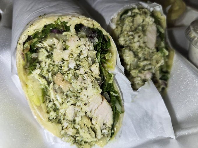 The chicken pesto wrap – where Italian flavors meet portable convenience in a handheld package that makes desk lunches suddenly exciting again.