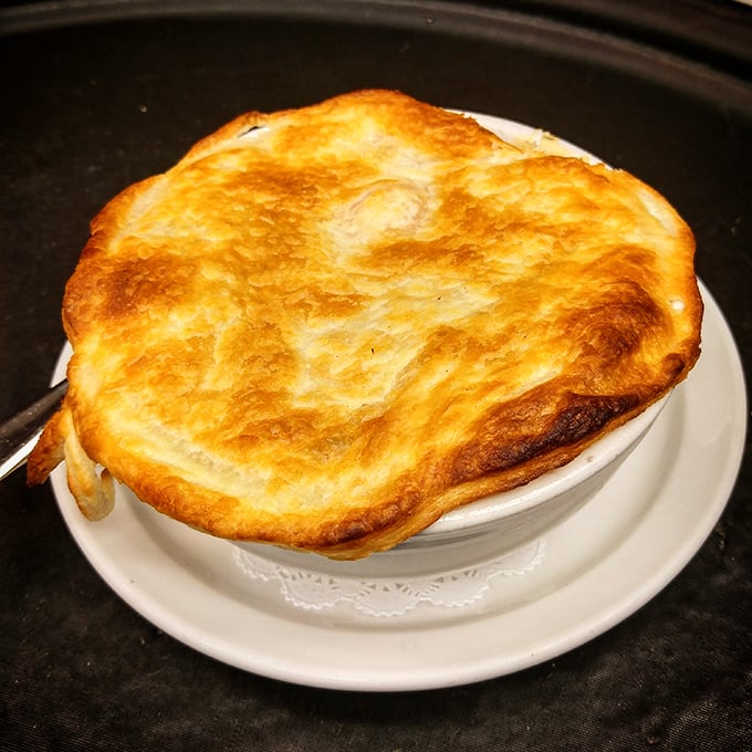This chicken pot pie isn't messing around – that golden dome of pastry is the roof over a neighborhood of comfort where all your favorite ingredients live harmoniously.