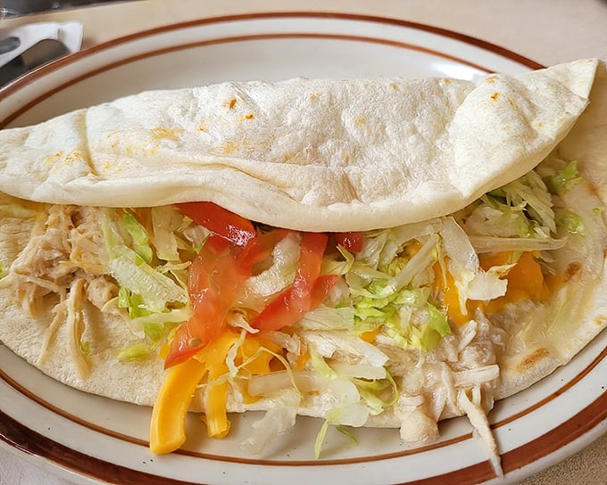 Simple yet sublime – a fresh tortilla cradling chicken and veggies becomes something transcendent when made with decades of know-how.