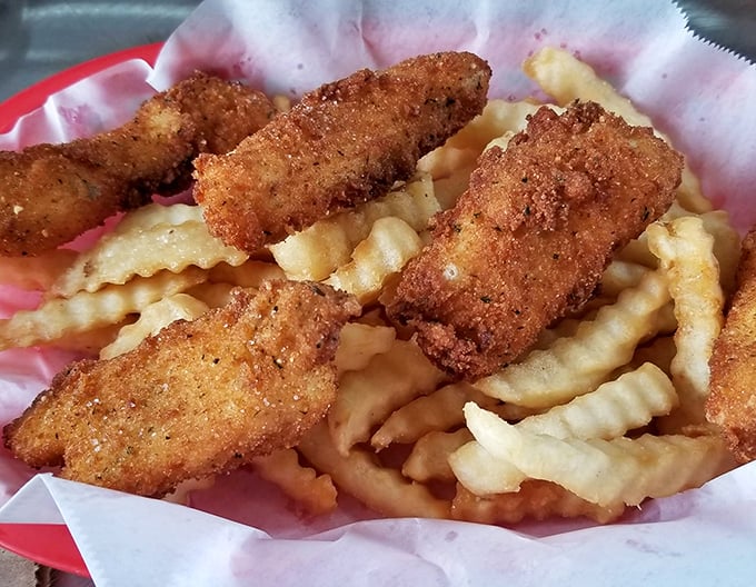 Crispy chicken tenders nestled among crinkle-cut fries – a combo that's kept kids and grown-ups happy since time immemorial.