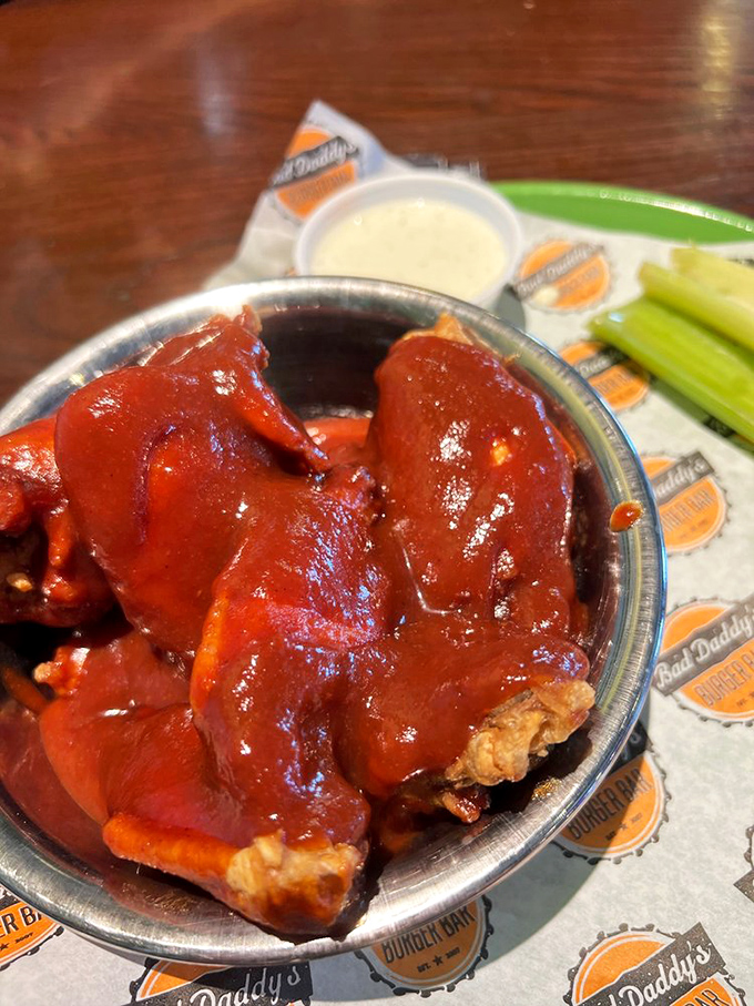 These wings aren't just swimming in sauce—they're doing the backstroke in a pool of flavor that demands both napkins and respect.