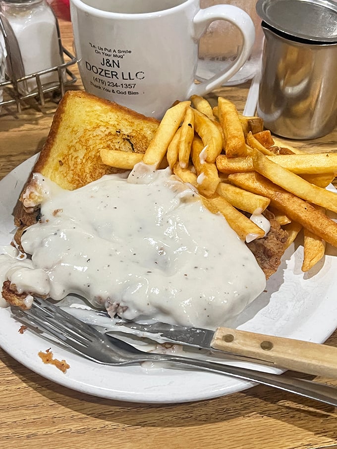 The chicken fried steak – where gravy isn't just a topping, it's a warm, peppery blanket tucking in a perfectly crispy cutlet.