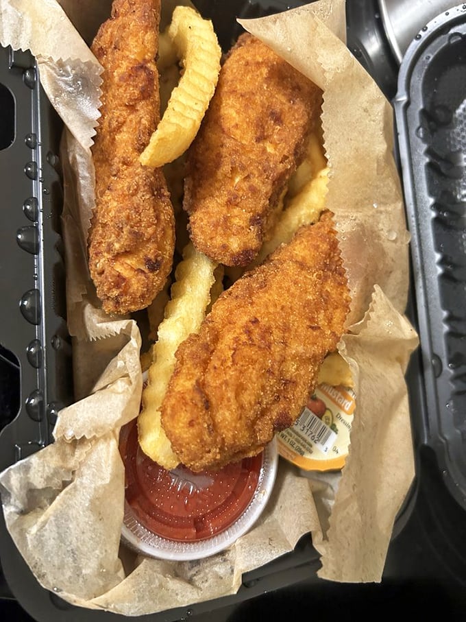 Golden-fried perfection with crinkle-cut companions. These chicken tenders aren't just for kids—they're a crispy trip down memory lane.