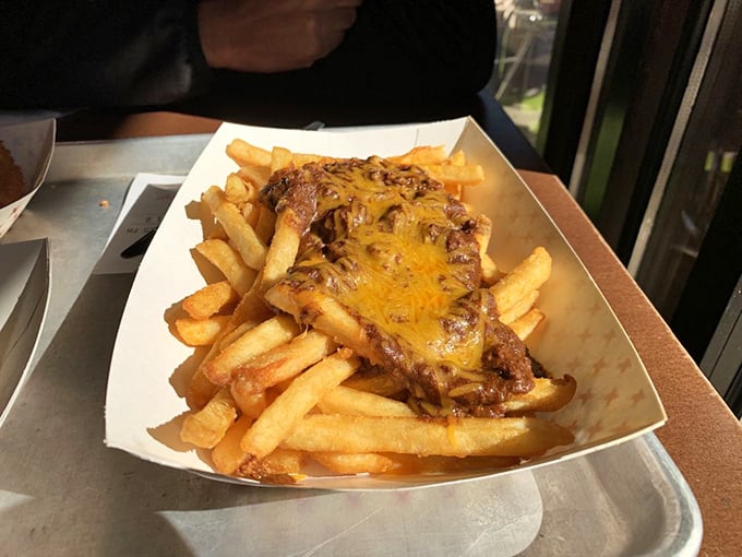 Chili cheese fries that laugh in the face of diet plans. A beautiful mess that demands to be shared, photographed, and devoured with abandon.