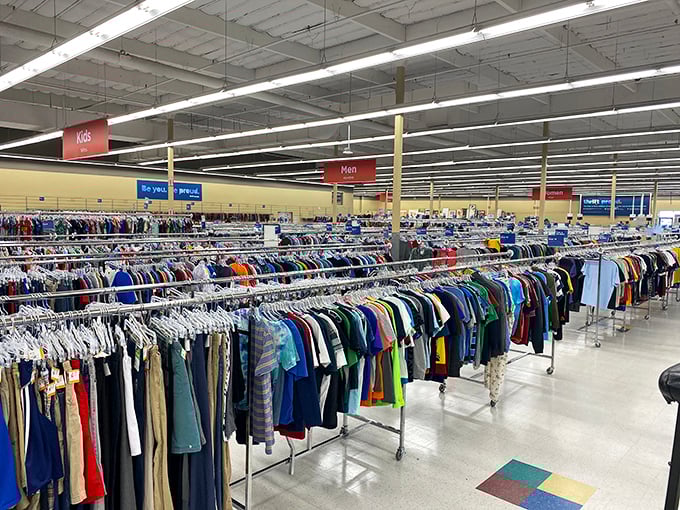 Clothing racks stretch toward the horizon, a textile rainbow organized with a precision that would make Marie Kondo weep with joy.