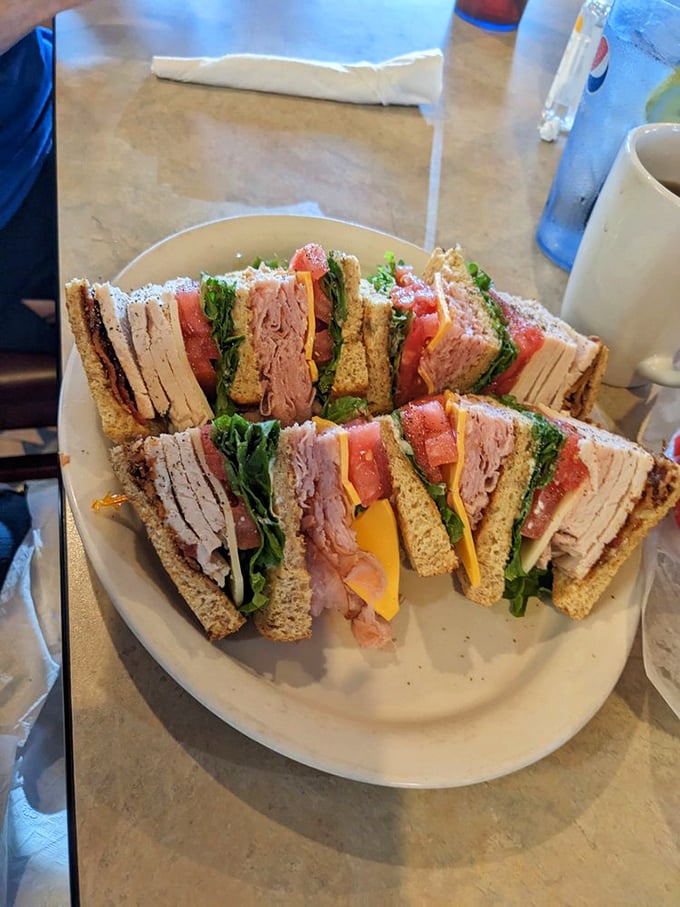 The club sandwich – architectural marvel of the diner world. Three stories of deliciousness that requires strategic planning just to take a bite.
