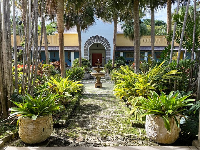 Another courtyard, another fountain—this symmetrical garden path leads the eye toward an arched doorway promising more wonders inside.