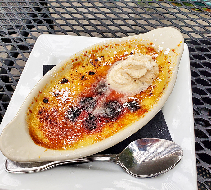 Crème brûlée with a perfect crackling top – like breaking through ice on a winter pond to find creamy treasure below.