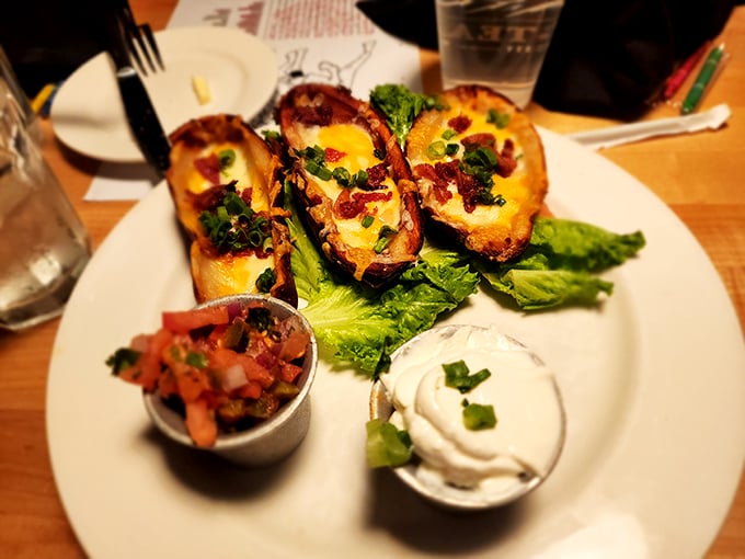 These aren't just potato skins—they're edible canoes filled with treasure. The sour cream and salsa are there for dipping, dunking, or artistic expression.