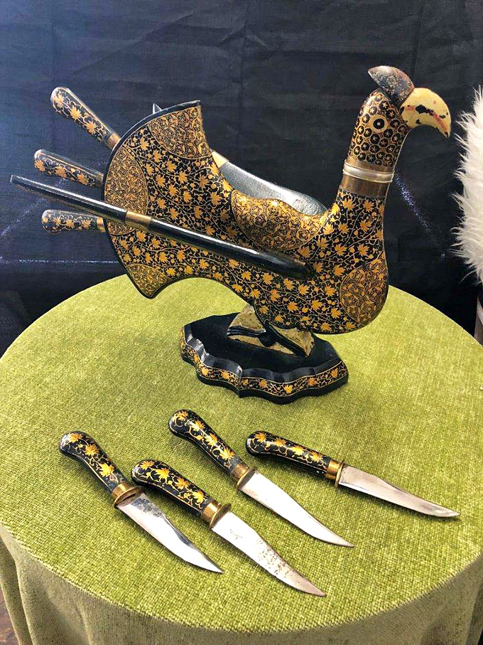 This ornate knife set holder proves that even the most unusual items find their way to thrift store shelves. Someone's conversation piece awaits!