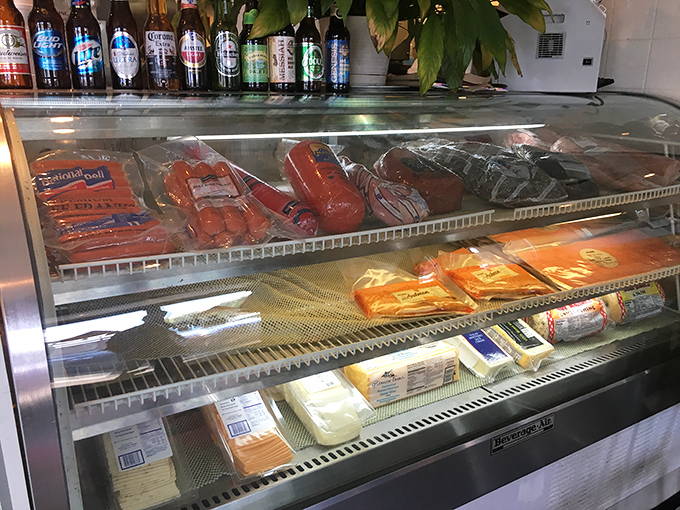 Behind this glass lies the foundation of deli greatness—meats and cheeses waiting for their moment to shine between two slices of bread.