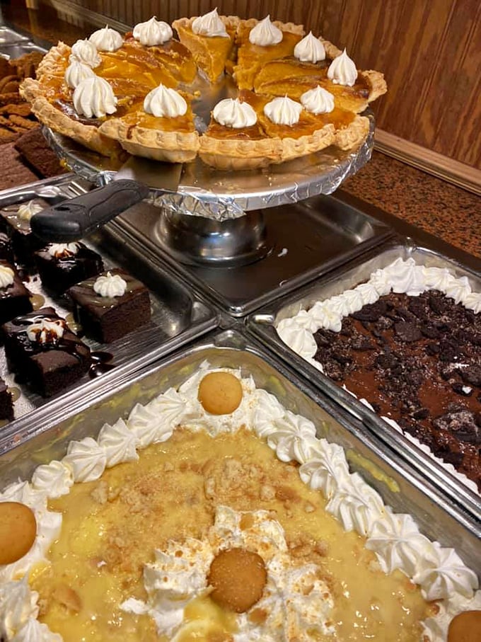 Banana pudding with vanilla wafers, pumpkin pie with whipped cream dollops, and chocolate cake—the holy trinity of Southern desserts all in one blessed buffet.