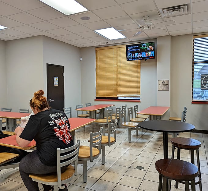 Simple tables, clean floors, and a staff shirt that probably lists barbecue competitions won. This is where you come for the food, not the frills.