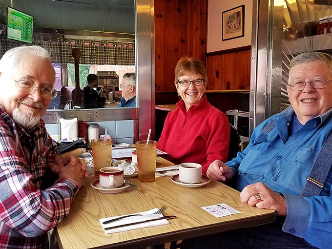 These happy diners aren't just enjoying coffee—they're participating in a ritual of community that's increasingly rare in our digital world.