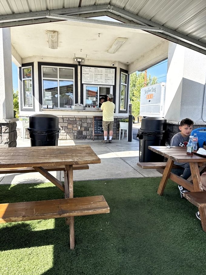 The outdoor seating area – where strangers become friends united by the universal language of "mmm" and "you've got sauce on your chin."