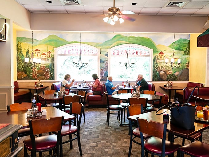 The dining room buzzes with the energy of satisfied customers, all gathered beneath murals that would make any Italian grandmother nod approvingly.