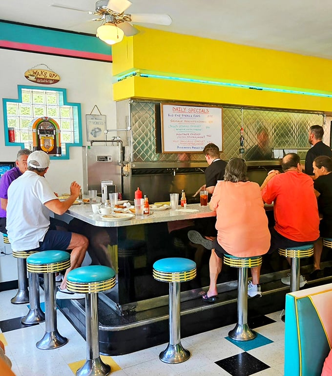 The counter seating—where solo diners become regulars and the short-order symphony plays out right before your eyes.