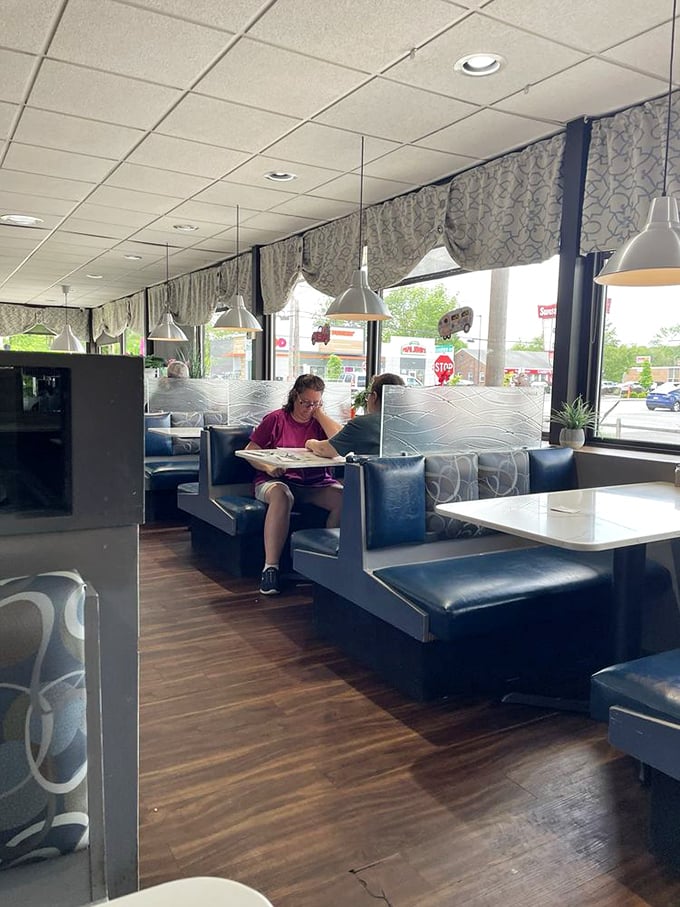 The window booths—prime real estate for people-watching while contemplating whether you have room for pie.