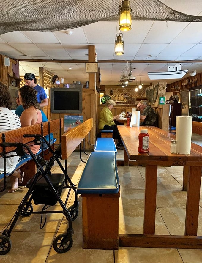 The communal tables aren't just furniture—they're gathering spots where strangers become friends over shared love of seafood.