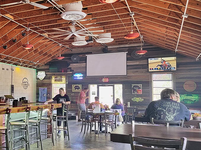 The universal language of barbecue brings folks together under wooden rafters. Notice how nobody's looking at their phones—the food demands full attention.