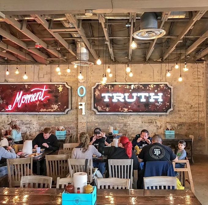Under the glow of Truth's iconic signs, strangers become friends united by the universal language of "Did you try the brisket yet?"
