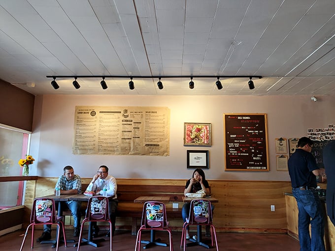 Simple wooden tables and track lighting create the perfect stage for the real star of the show—sandwiches that deserve their own spotlight and standing ovation.