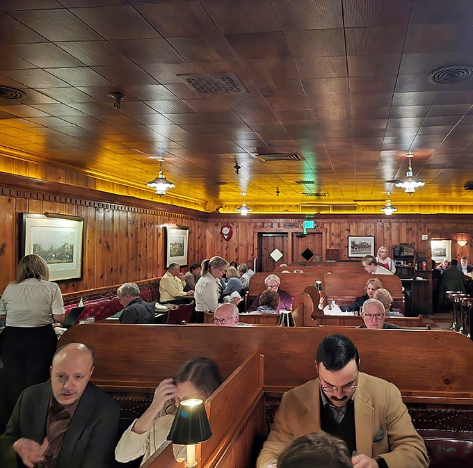 The dining room hums with conversation and anticipation – wooden booths filled with people making memories over perfectly cooked protein.