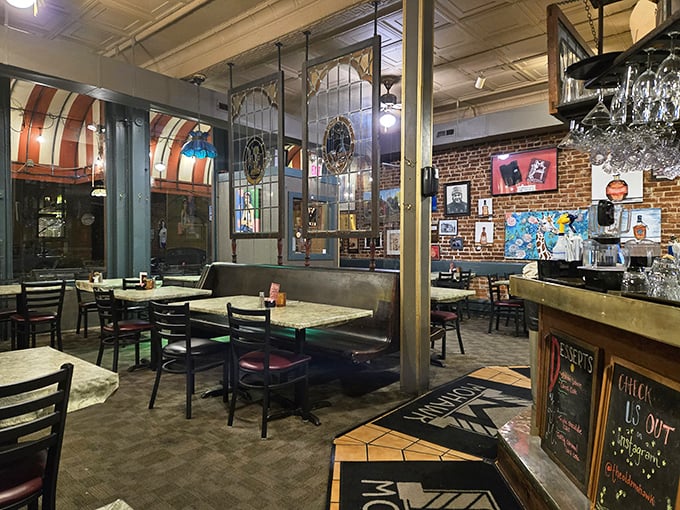 The dining area strikes that perfect balance between cozy and spacious, with stained glass dividers adding a touch of vintage charm.